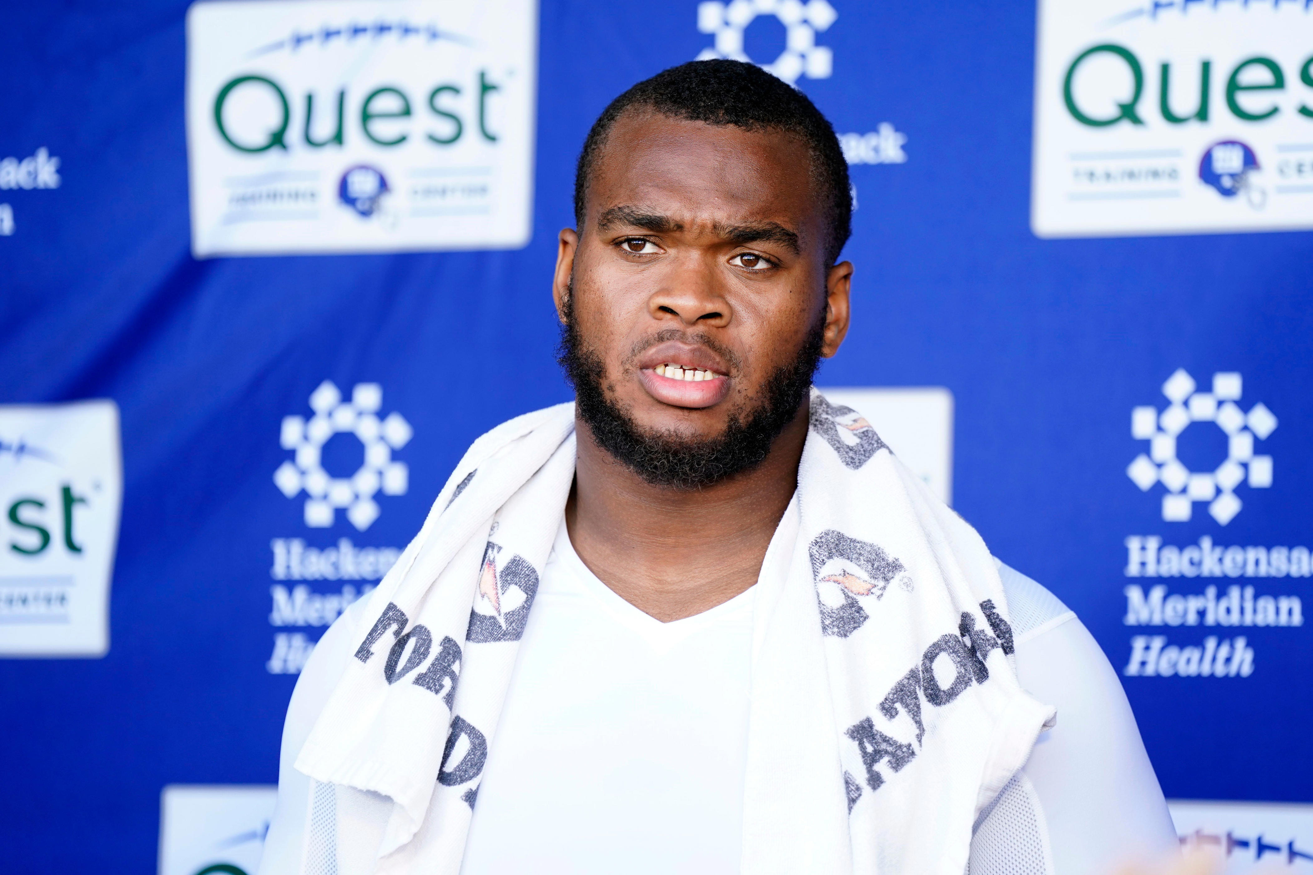 New York Giants' Evan Neal earns first-team reps at guard during OTAs