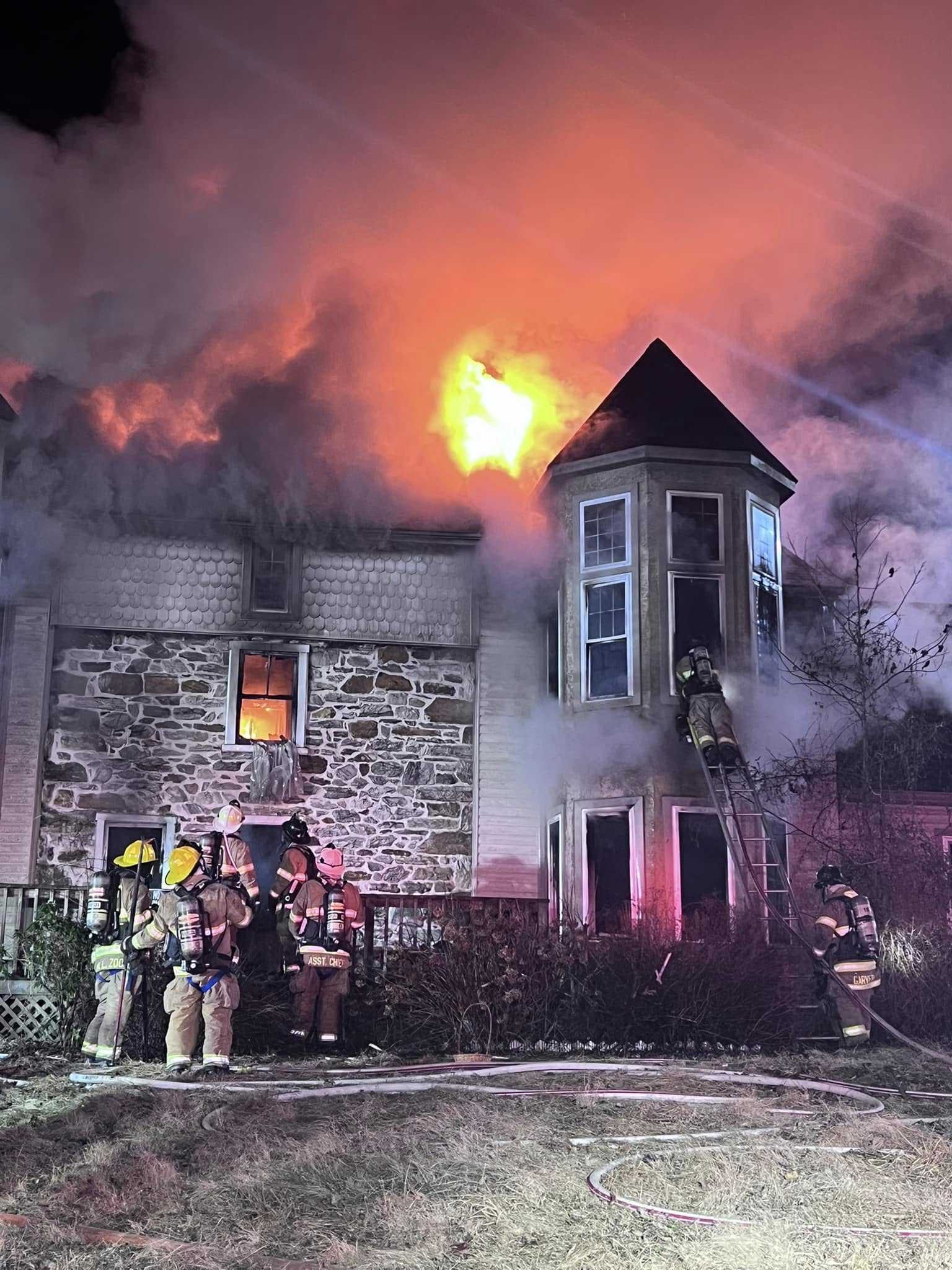 Heavy flames shoot from massive house fire