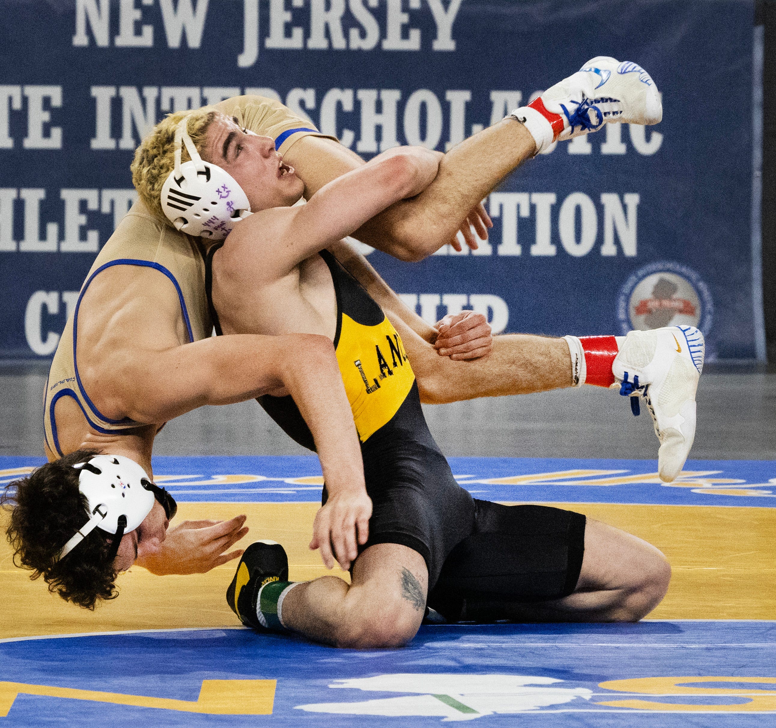 Court hears arguments on tournament ban of three-time wrestling champ ...