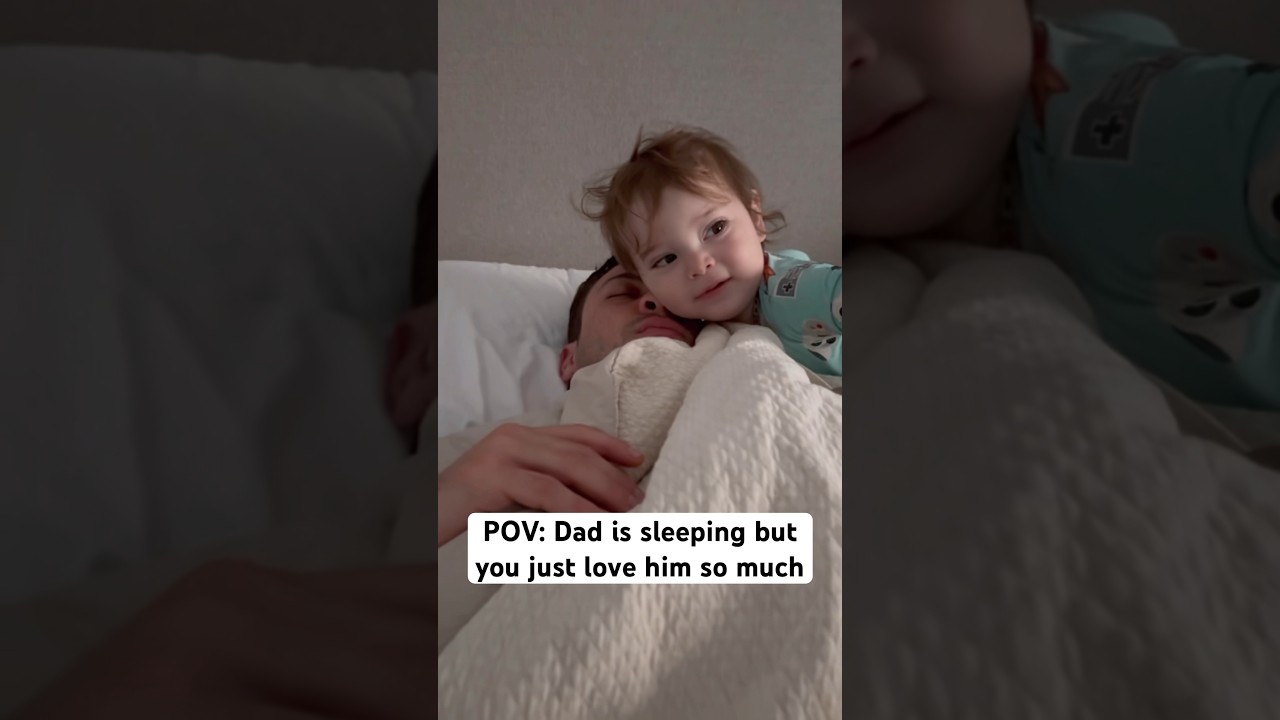 Patient baby waits for his hero to wake up