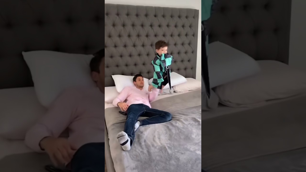 Mom catches dad balancing son on his hand
