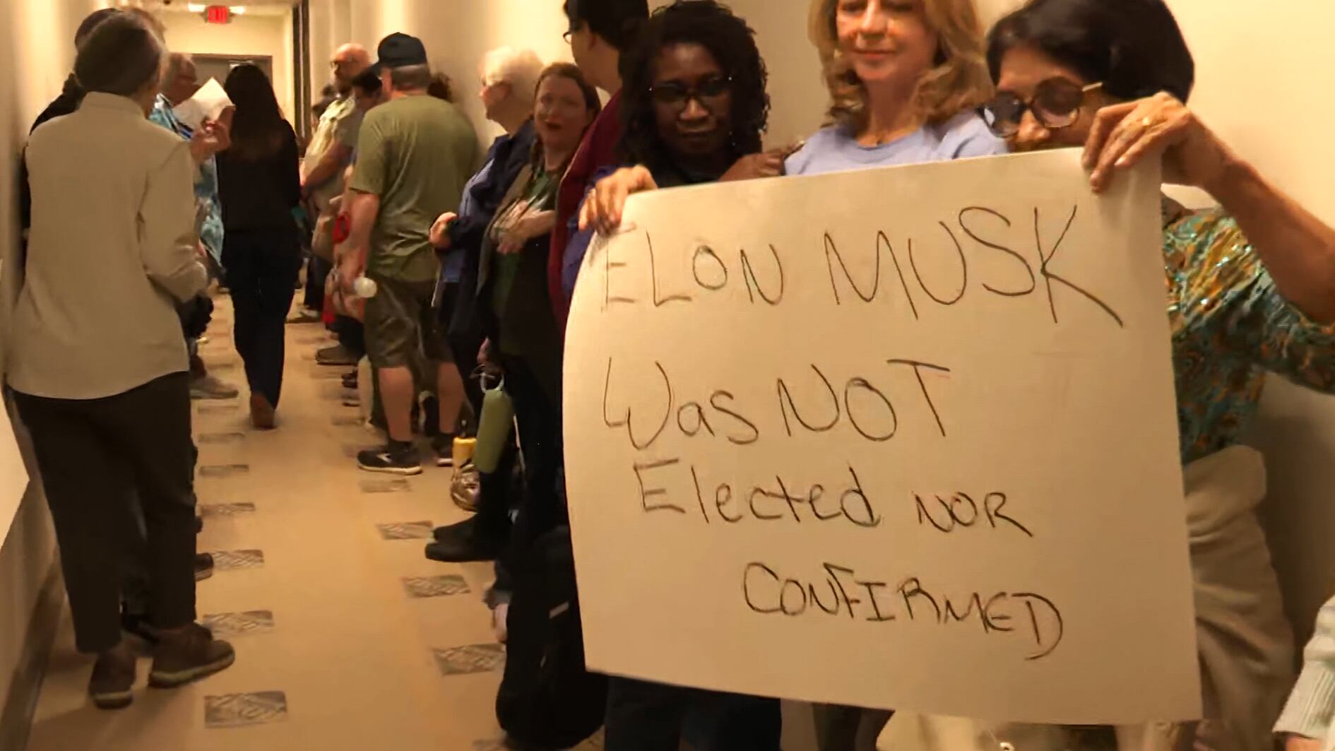 Crowd of nearly 100 floods Rep. Allen’s Augusta office for protest