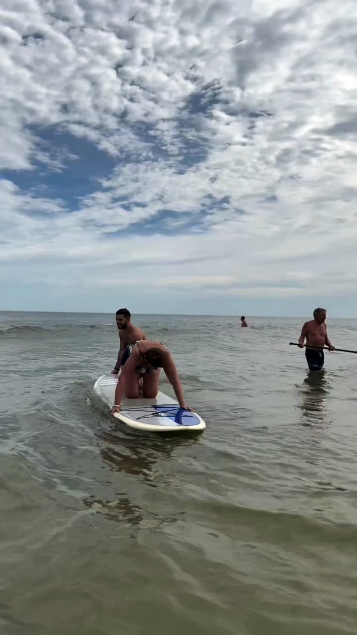 Beginner Surfer Takes Unintentional Dive as Wave Knocks Her Over