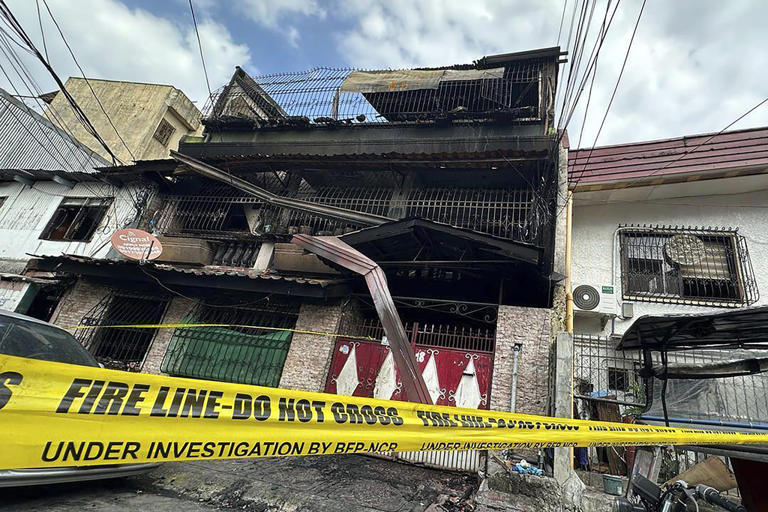 Fire that gutted building in less than an hour kills 8 in the Philippines