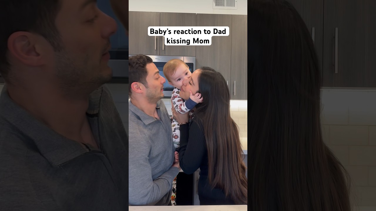 Baby’s Face When Dad Kisses Mom—Too Cute!