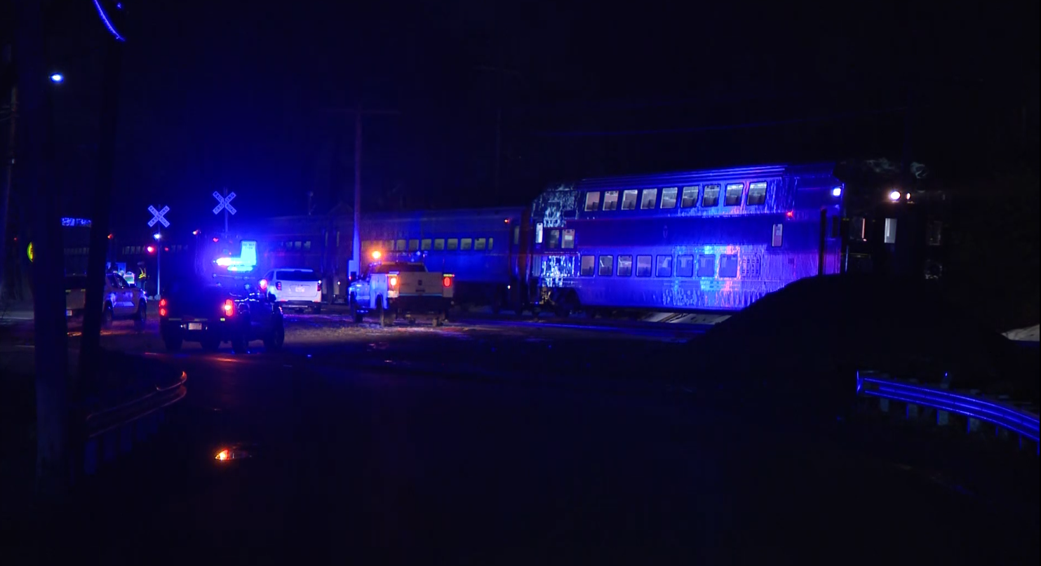 Car struck by MBTA train after driver stopped on tracks, transit police say