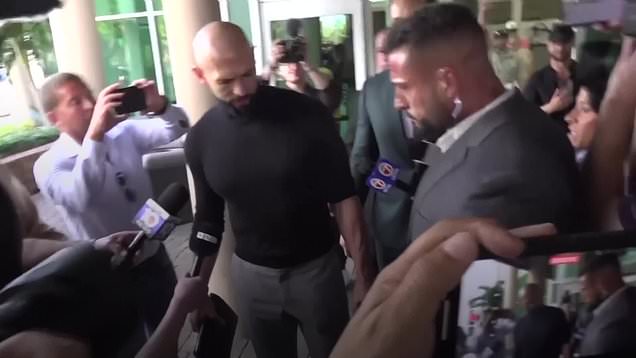 Andrew Tate says he is 'innocent until proven guilty' after landing in ...