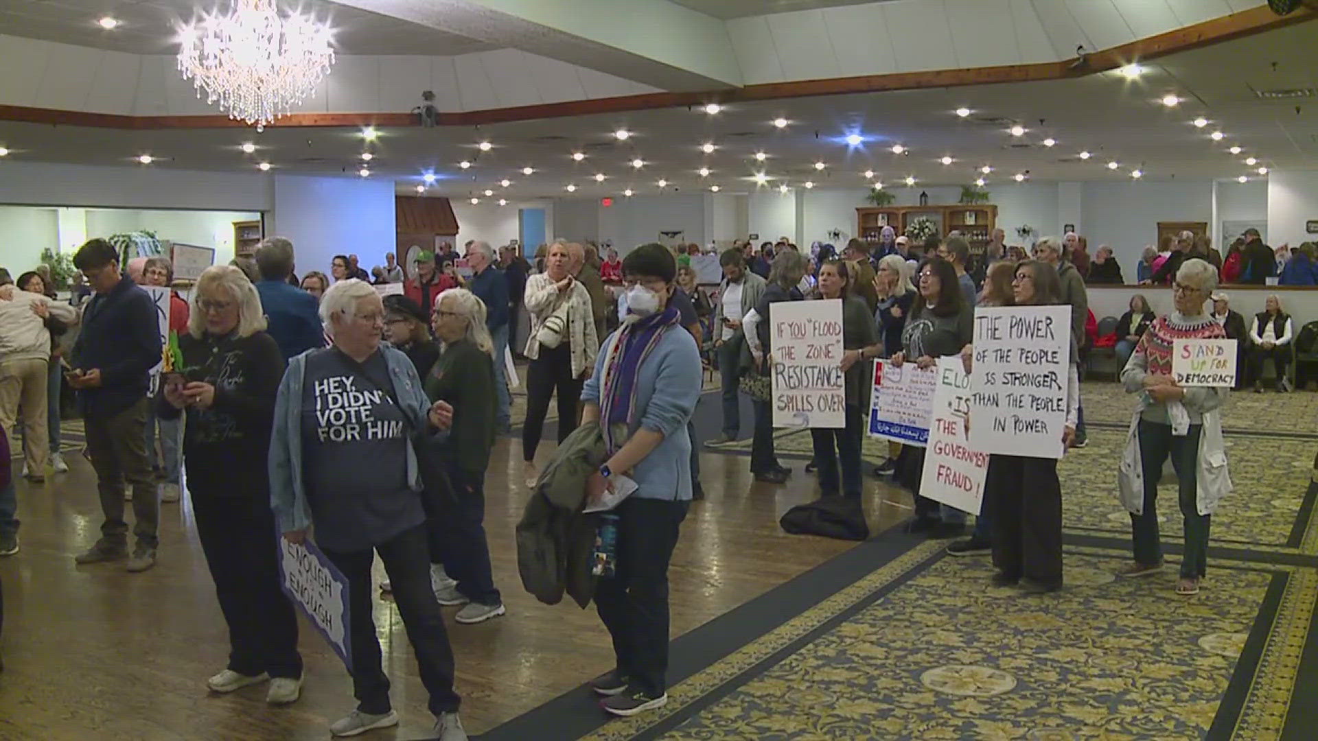 Quad Cities community members protest firings of federal workers