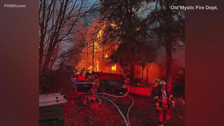 Multiple fire crews battle house fire in Mystic