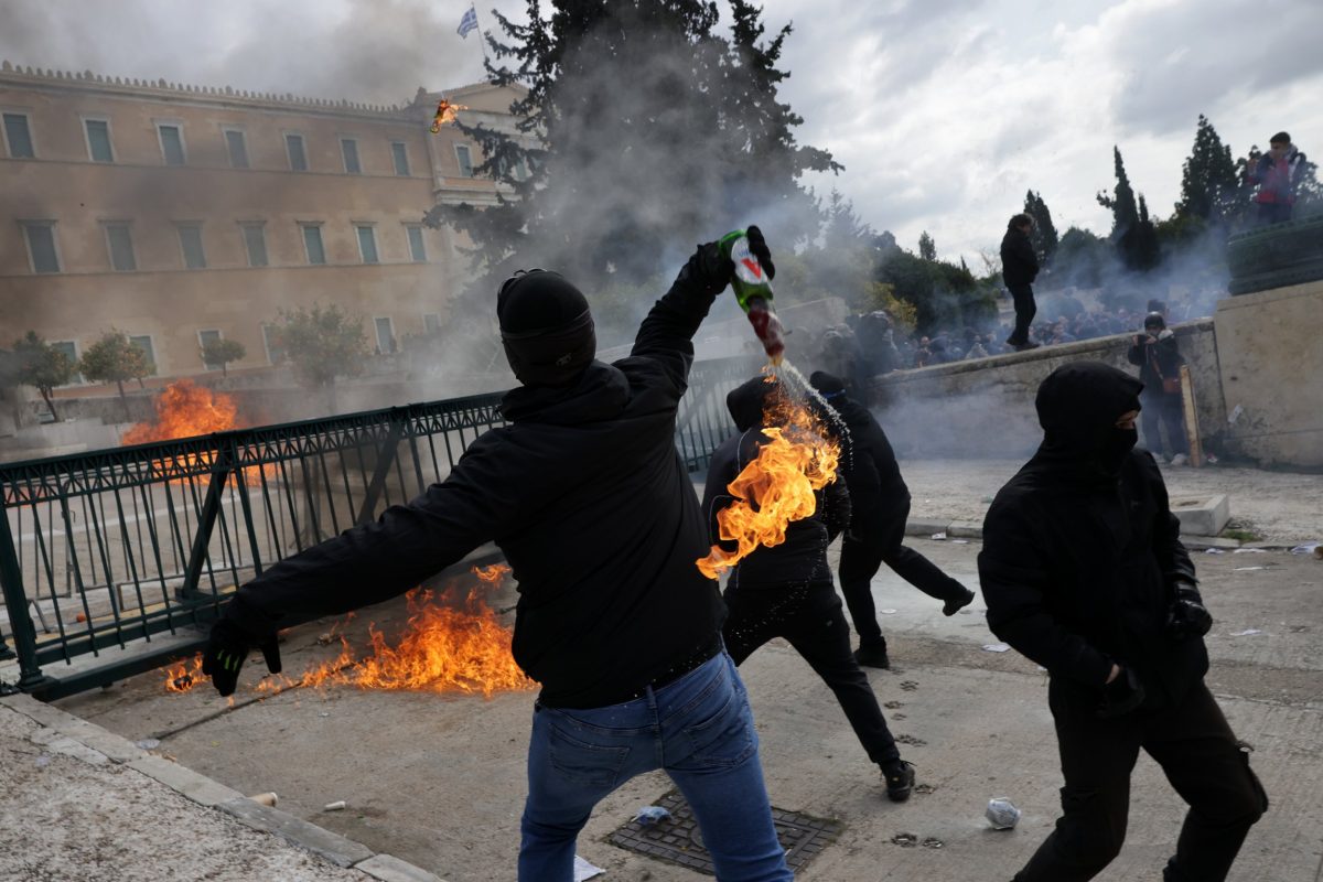 Protesters throw petrol bombs at police as Greece shuts down with ...