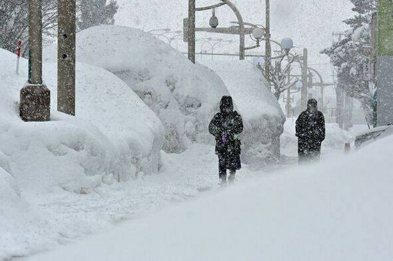 The world's snowiest city gets 26ft of snow as temperatures plunge to -11F