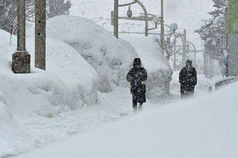 The world's snowiest city gets 26ft of snow as temperatures plunge to -11F