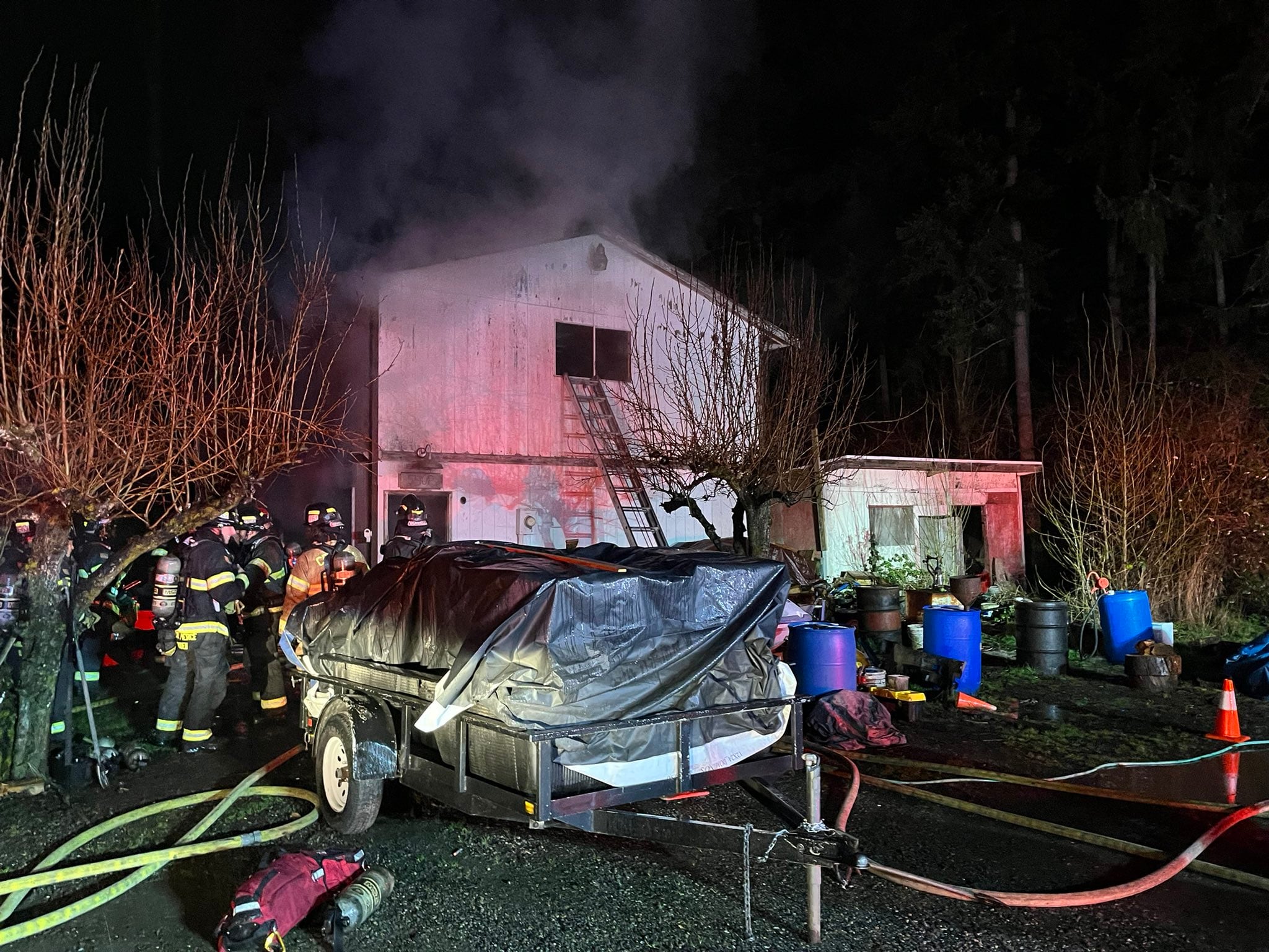 Two people escape uninjured after two-story house fire in Parkland