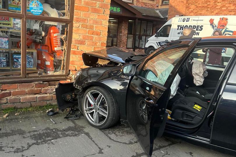 Huge delays after car crashes into town centre store