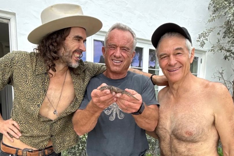 RFK slammed for holding a lizard in 'weird' photo with Russell Brand ...