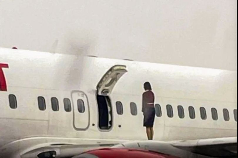 Airline launches probe after flight attendant 'opened exit to pose for ...