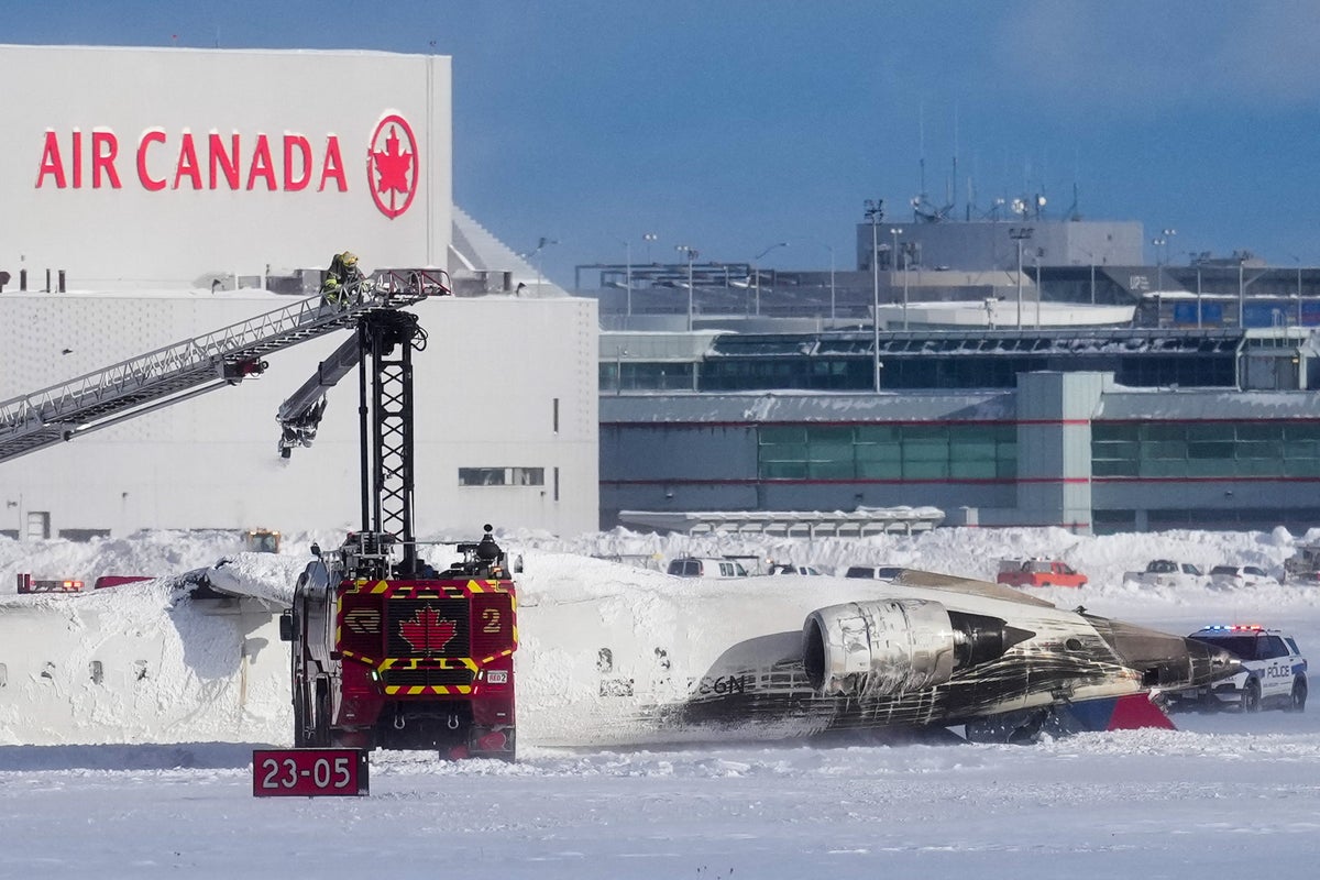 Delta plane flips over at Toronto airport leaving 18 injured, including ...