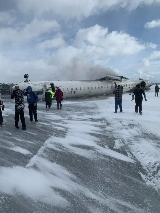 Delta flight flips over in Toronto, injuring 18 people Delta flight flips over in Toronto, injuring 18 people
