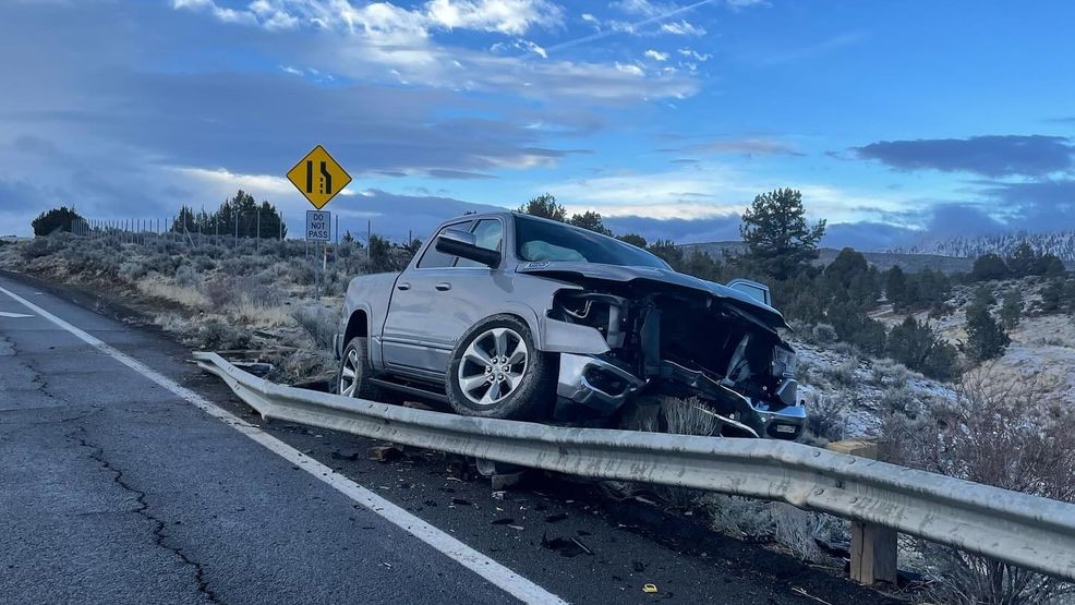 Pickup truck crashes into guard rail on US-395 amid slippery conditions