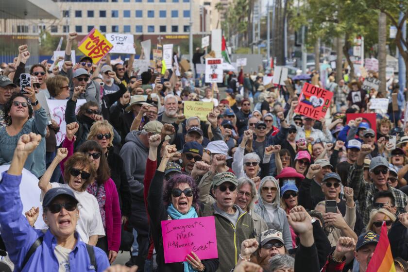 Hundreds rally in Long Beach to protest President Trump and Elon Musk