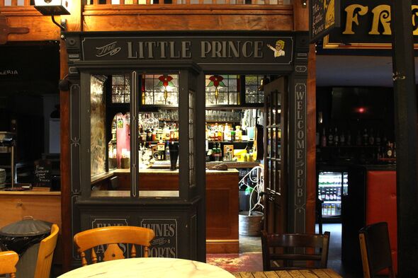 Inside what might be the UK's smallest pub - with only enough room for ...