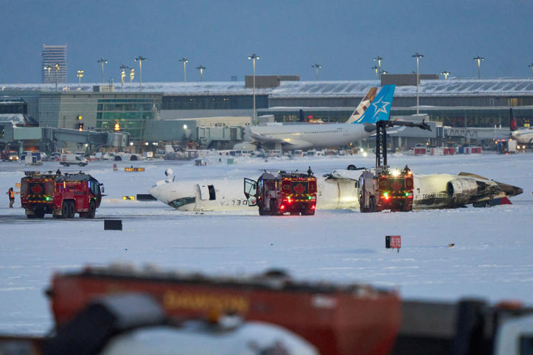 New video shows Delta plane flip during landing on Toronto runway which ...