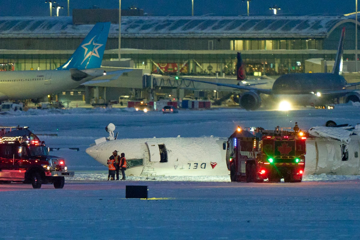 Watch: Aftermath of Delta plane crash after flight 4819 flips over in ...