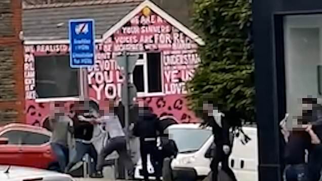 Huge street brawl sparked by 'turf war' over rival barber shops