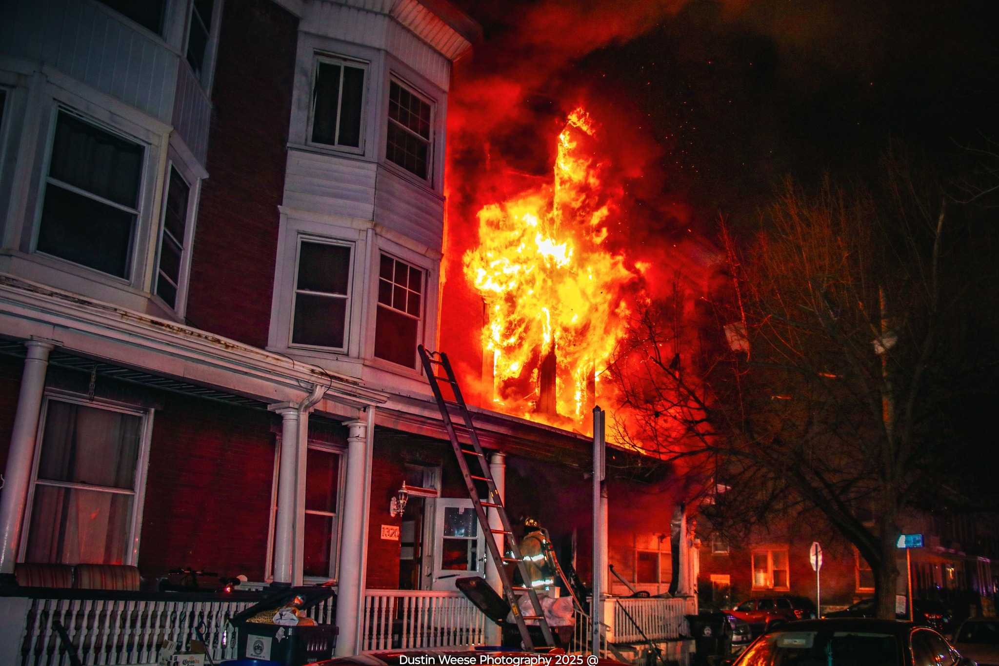 2 firefighters injured, 19 residents displaced after 2-alarm row home fire