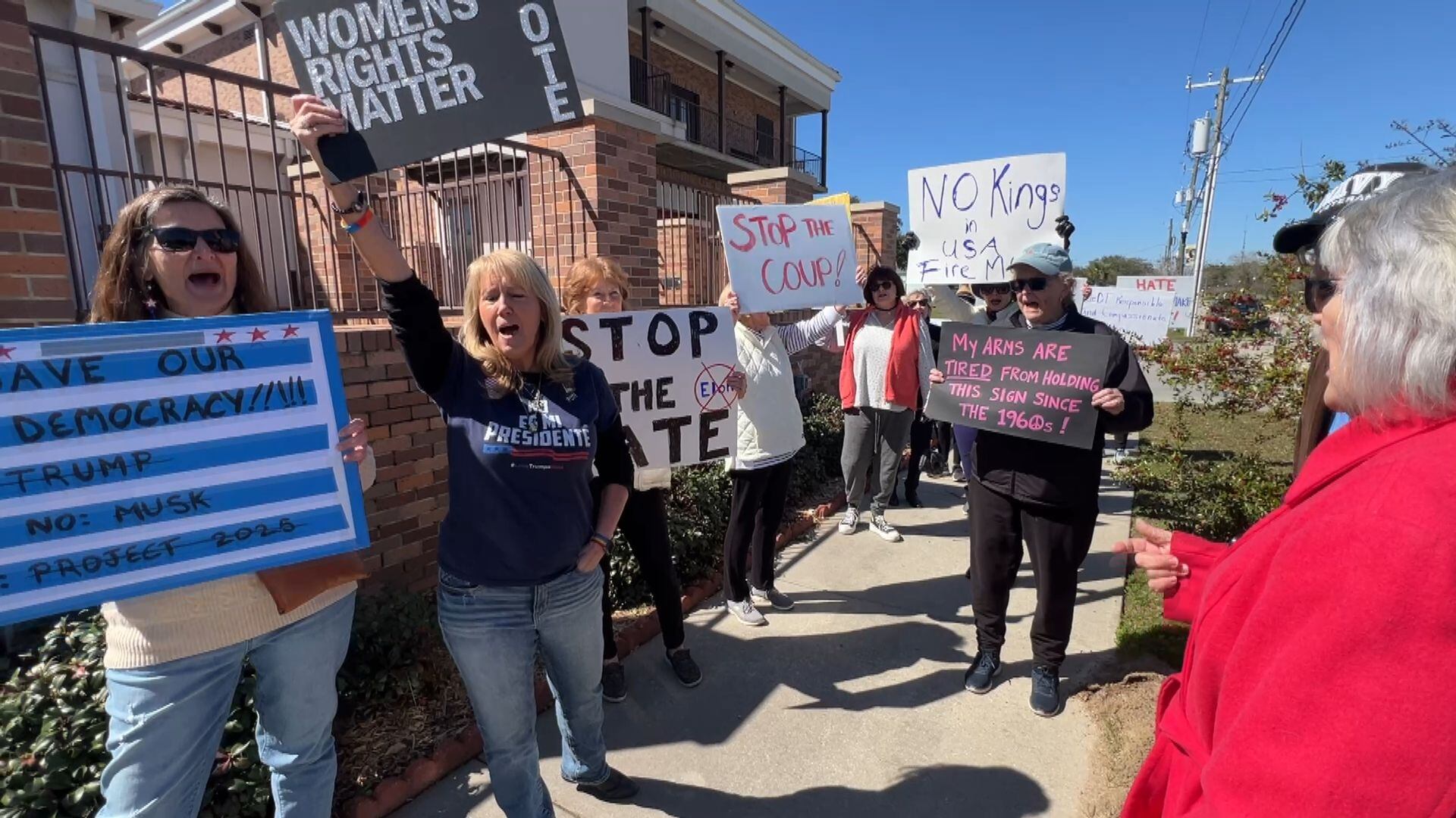 Democrats protest against Trump administration outside Waveland City ...
