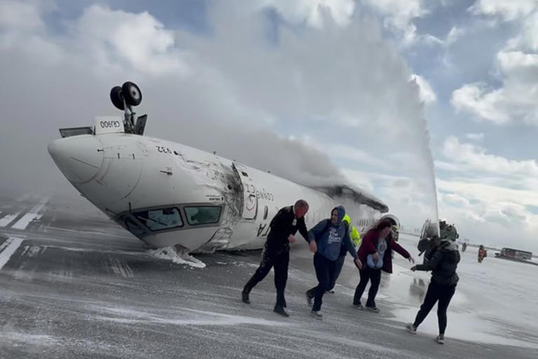 Delta plane flipped upside-down after ‘extreme’ weather — including 20 ...