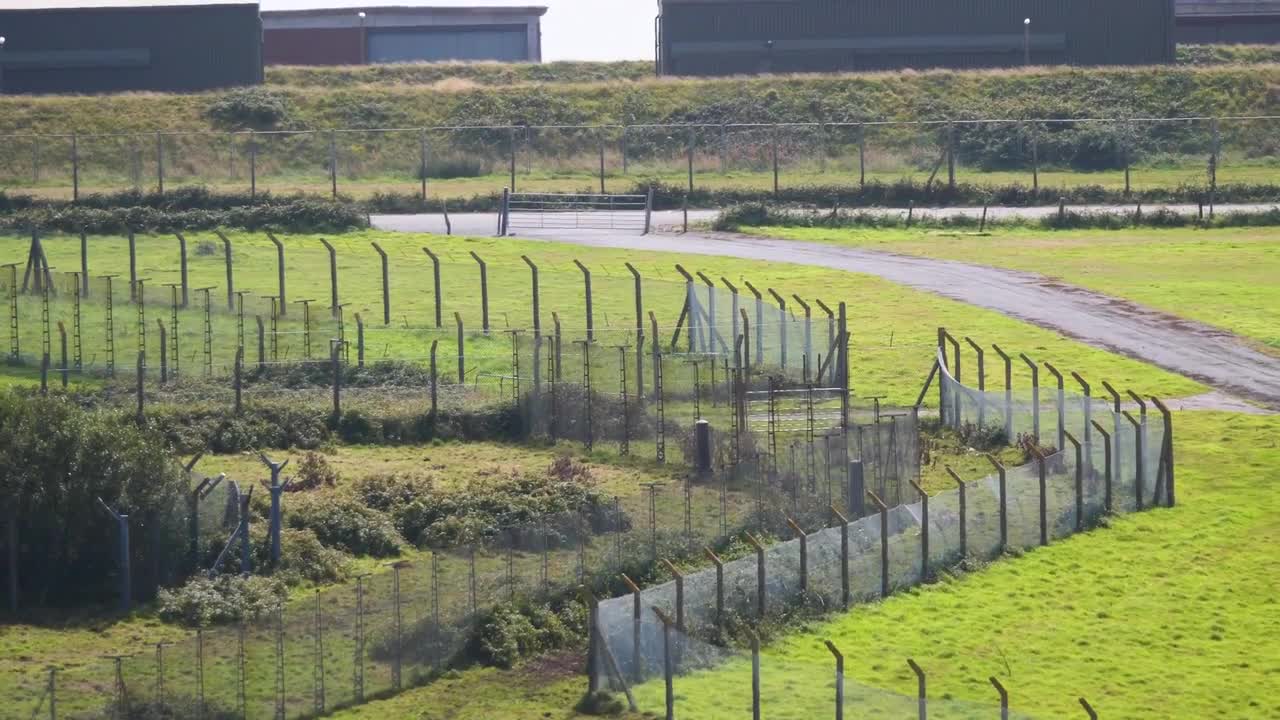 US Cold War Nuclear base decays slowly next to a busy tourist beach ...
