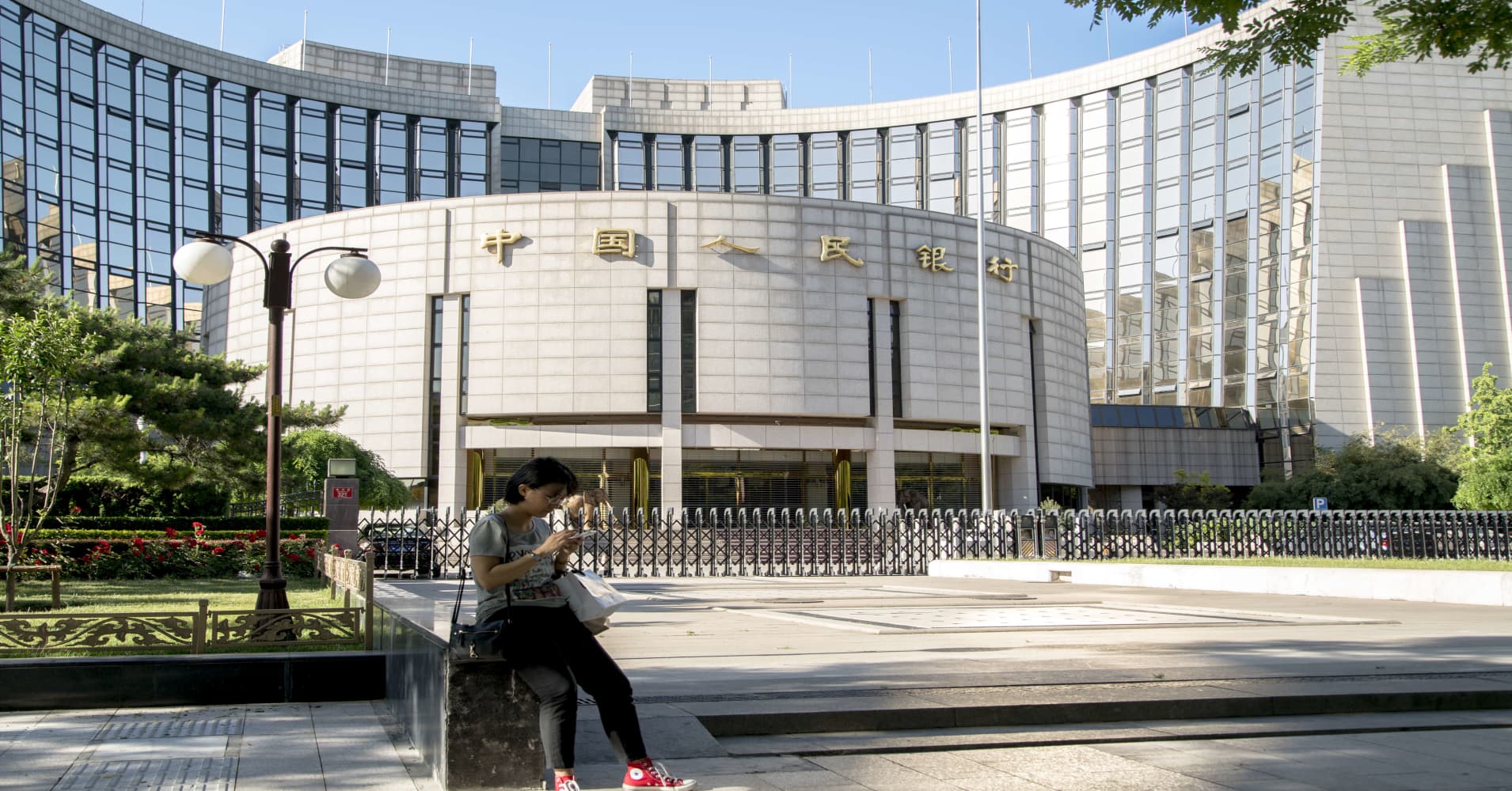 China is likely to cut its benchmark policy rate next month, economists ...