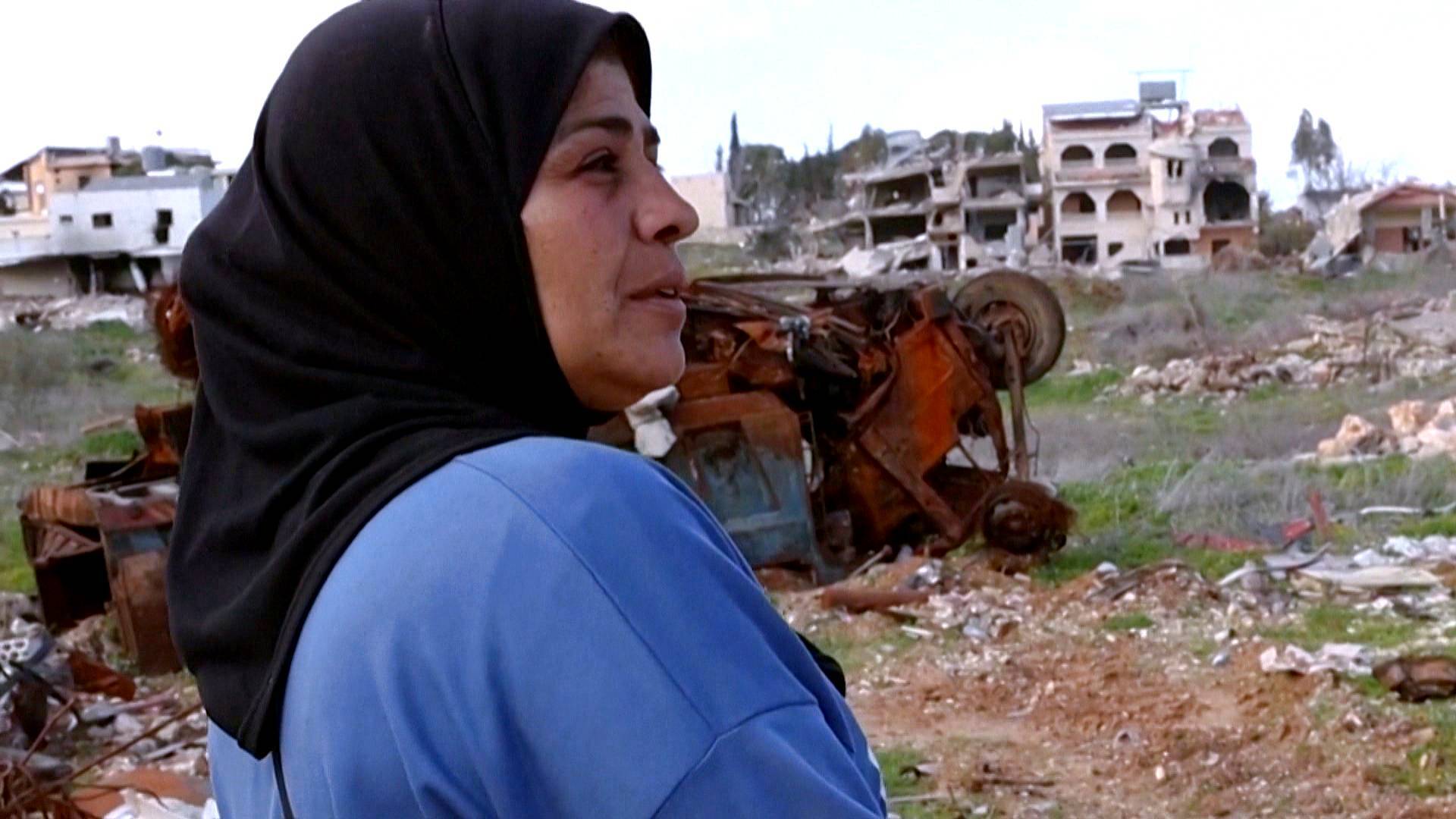 Displaced Lebanese woman returns to ruined home in Kfar Kila after ...
