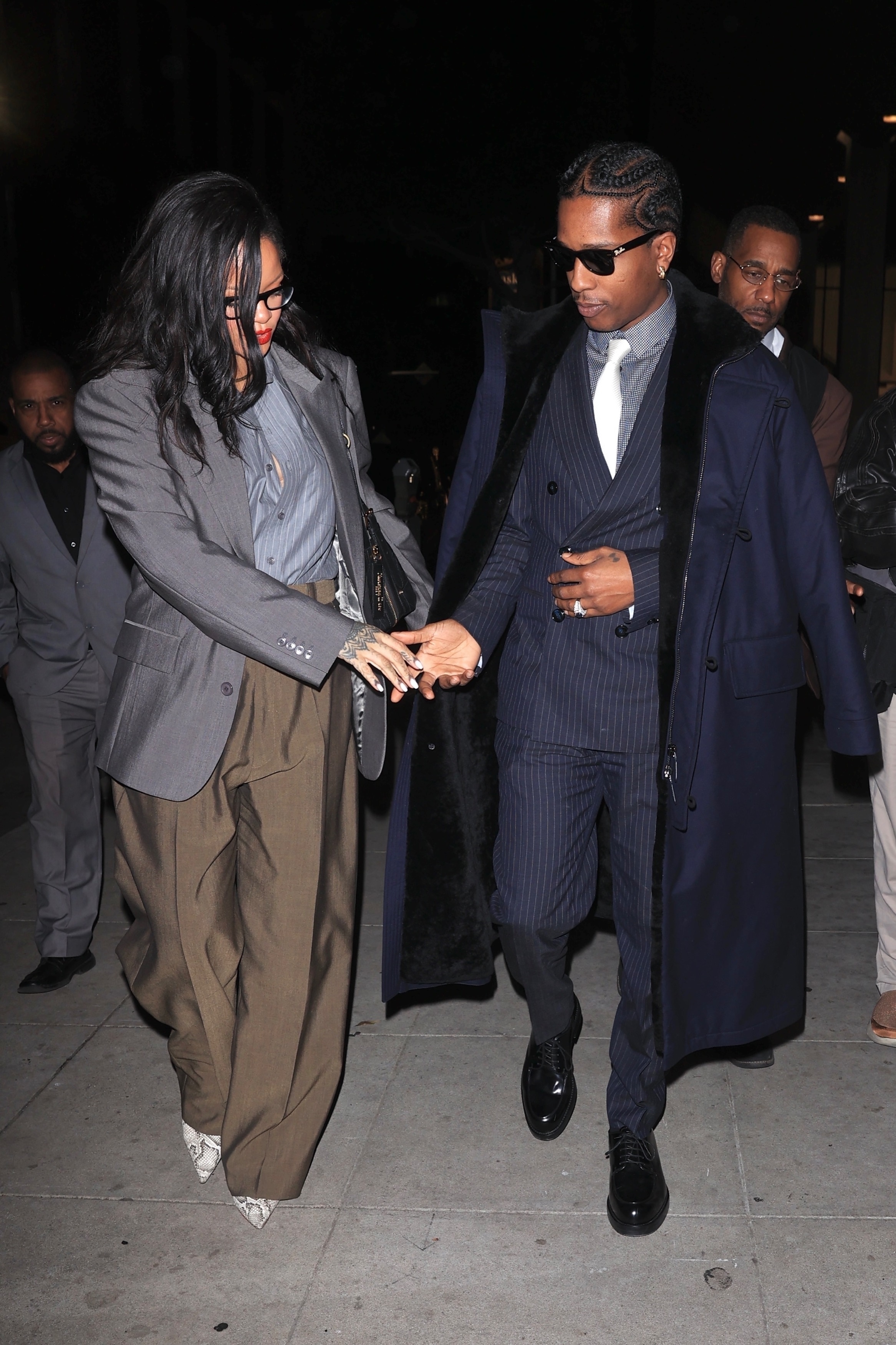 Rihanna and A$AP Rocky match in gray pinstripe suits at rapper’s trial