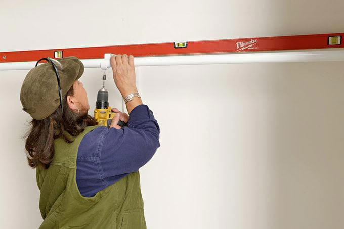 6 Simple Steps to Hang a Long Clothes Rod in Your Closet