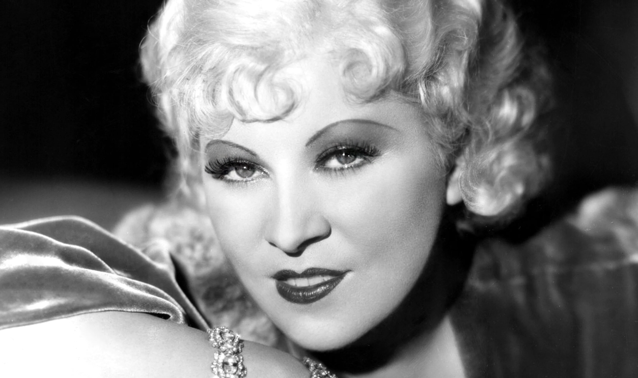 The Controversial Life Of Mae West—The Original Blonde Bombshell