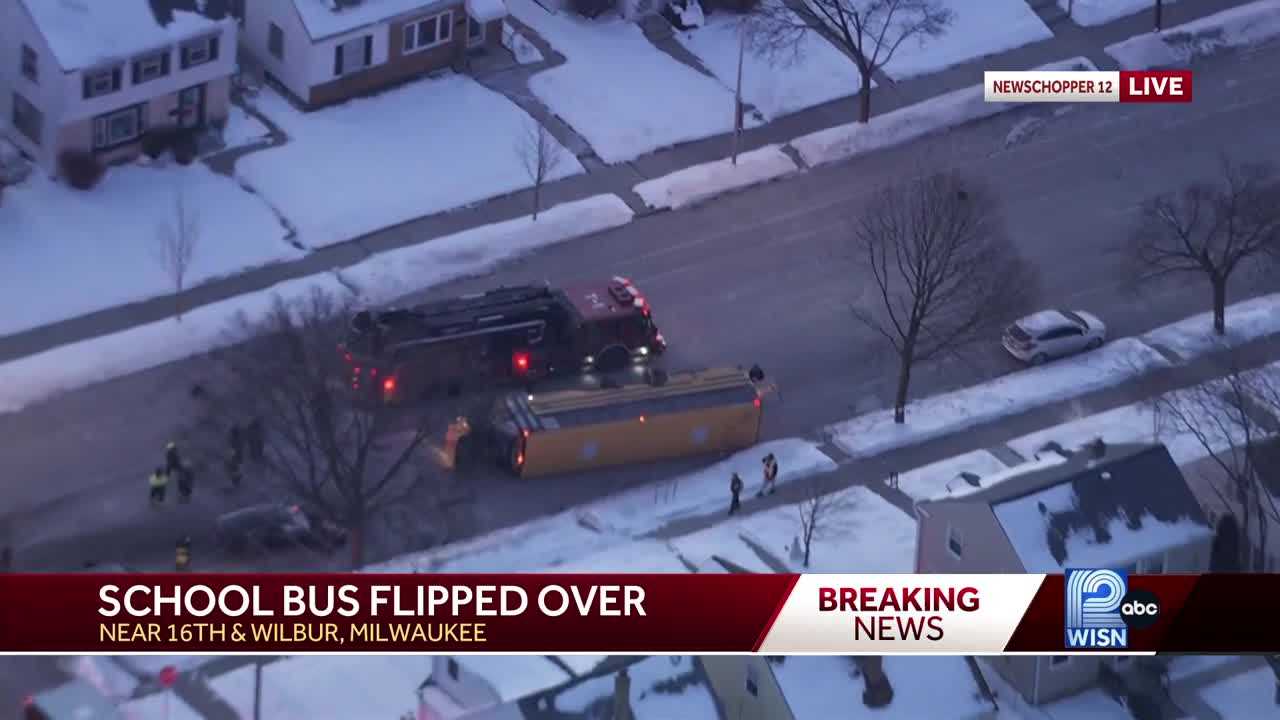 School bus flips on its side after crash in Milwaukee