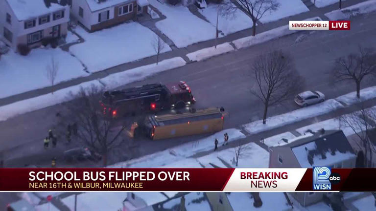 School bus flips on its side after crash in Milwaukee