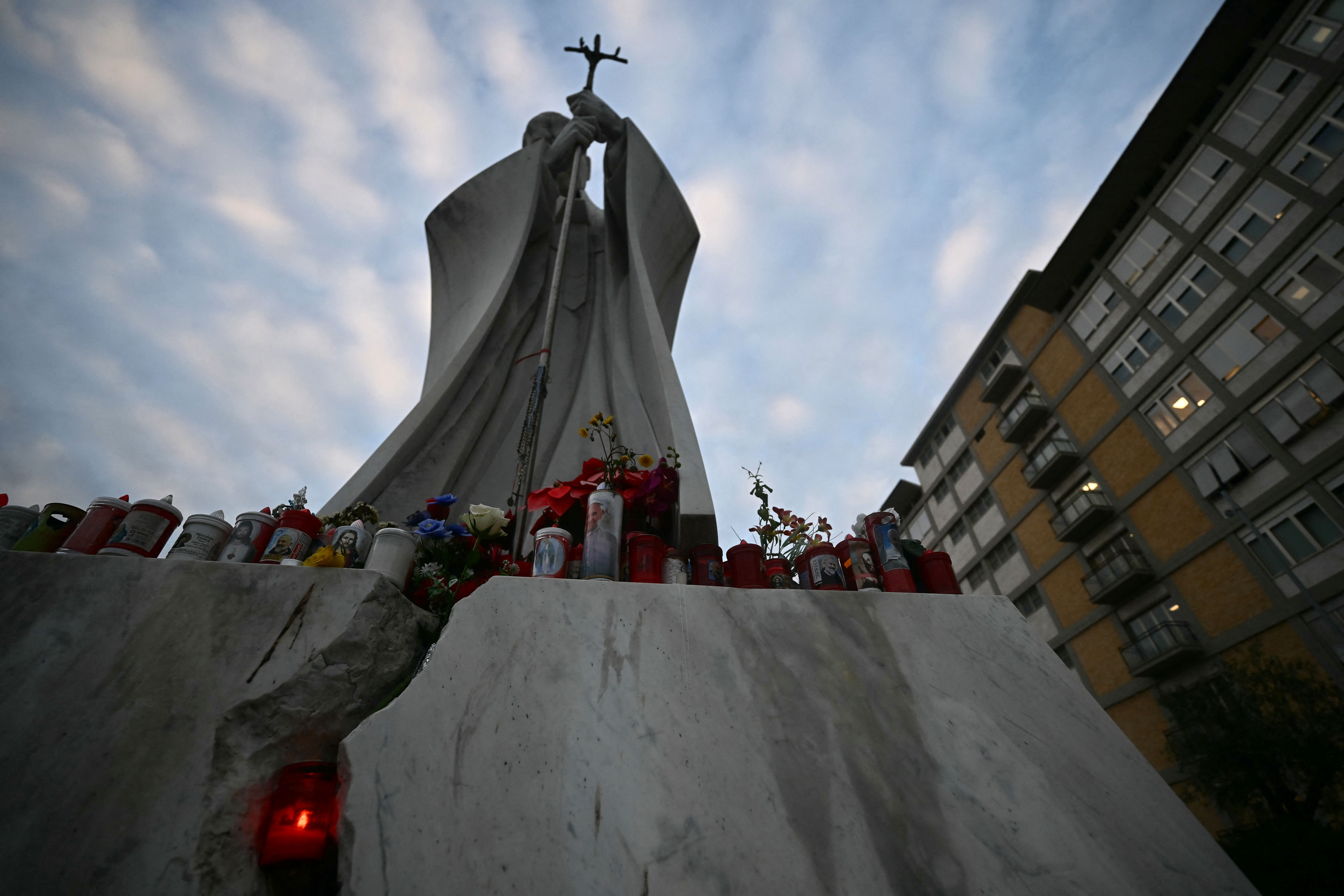 Pope ‘sitting up, eating’ in seventh day in hospital