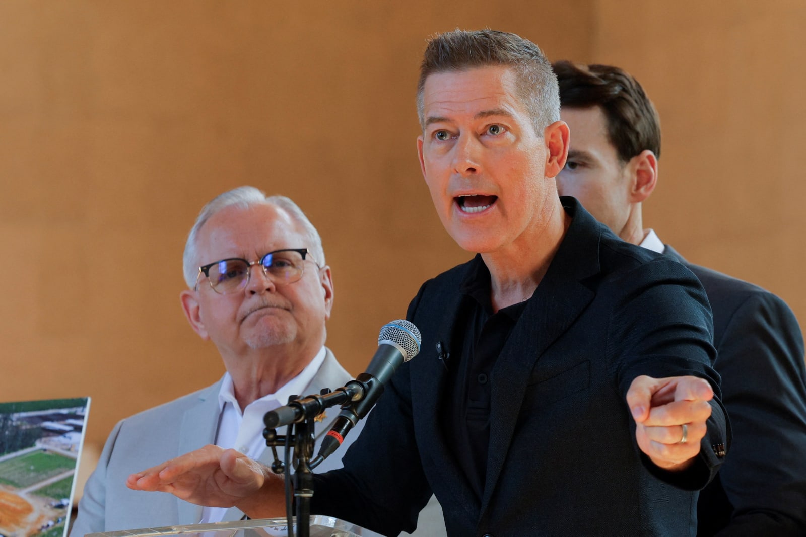 Trump official yells back as crowd drowns him in boos