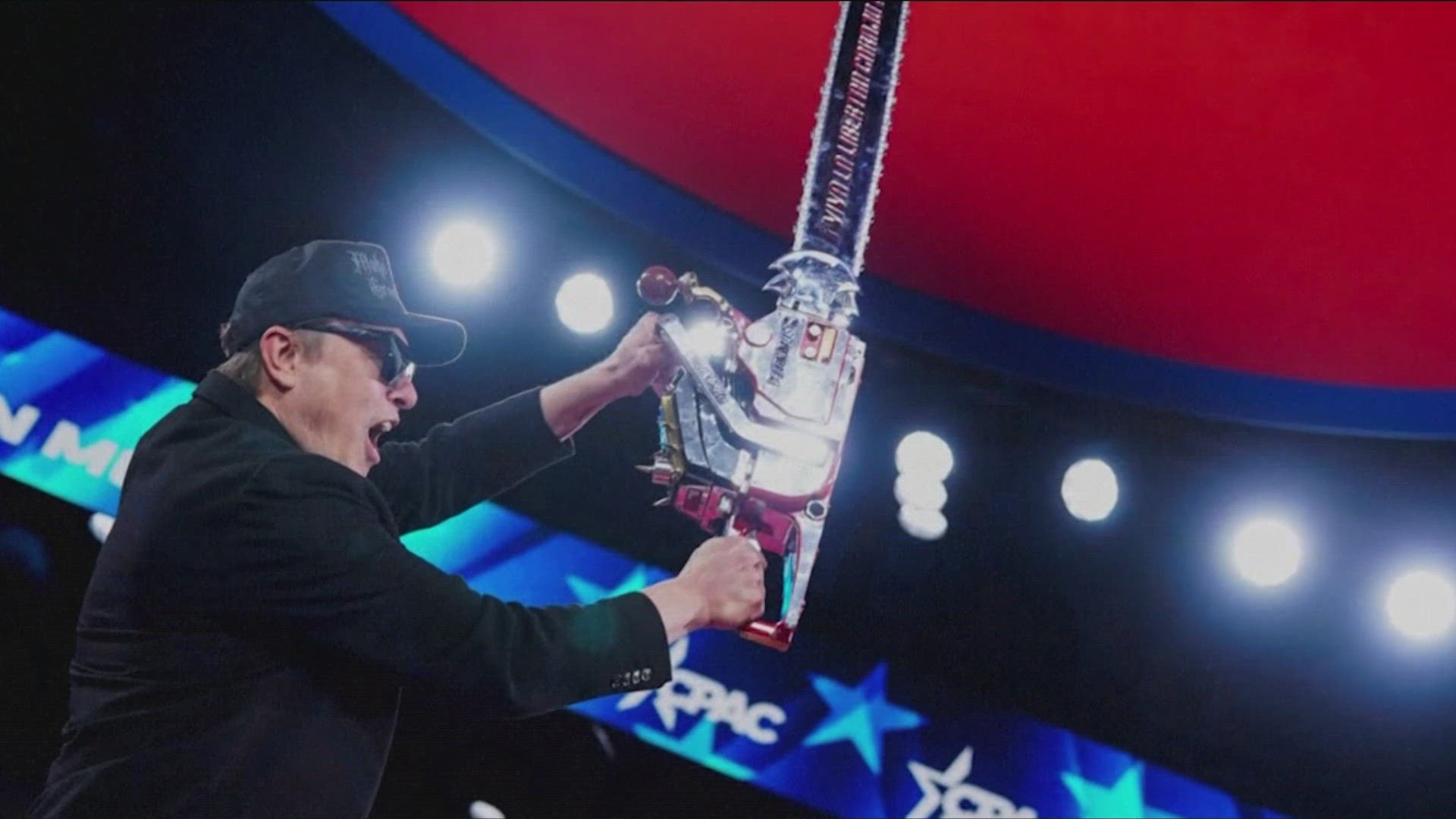 Elon Musk holds chainsaw on stage during conservative conference Elon Musk holds chainsaw on stage during conservative conference
