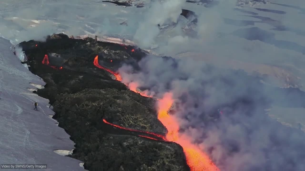Mount Etna's Fiery Spectacle Amidst Snow in Drone Footage