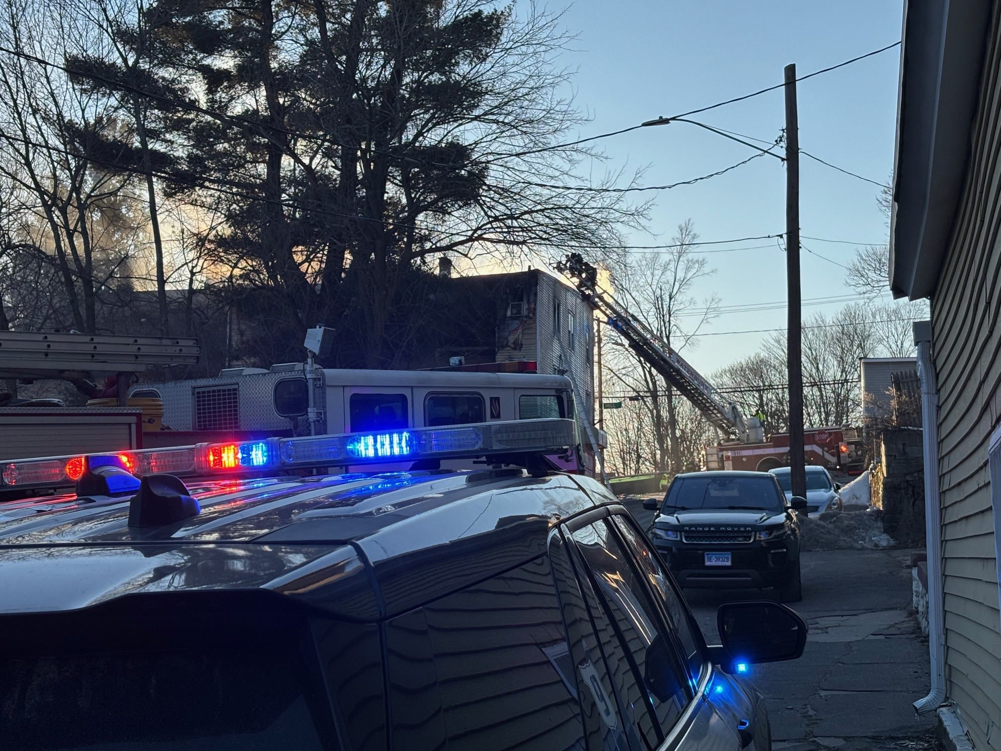 Crews battle fire at multi-family home in Waterbury
