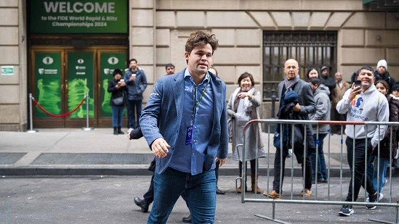 Chess grandmaster Carlsen defies dress code, now selling jeans for charity