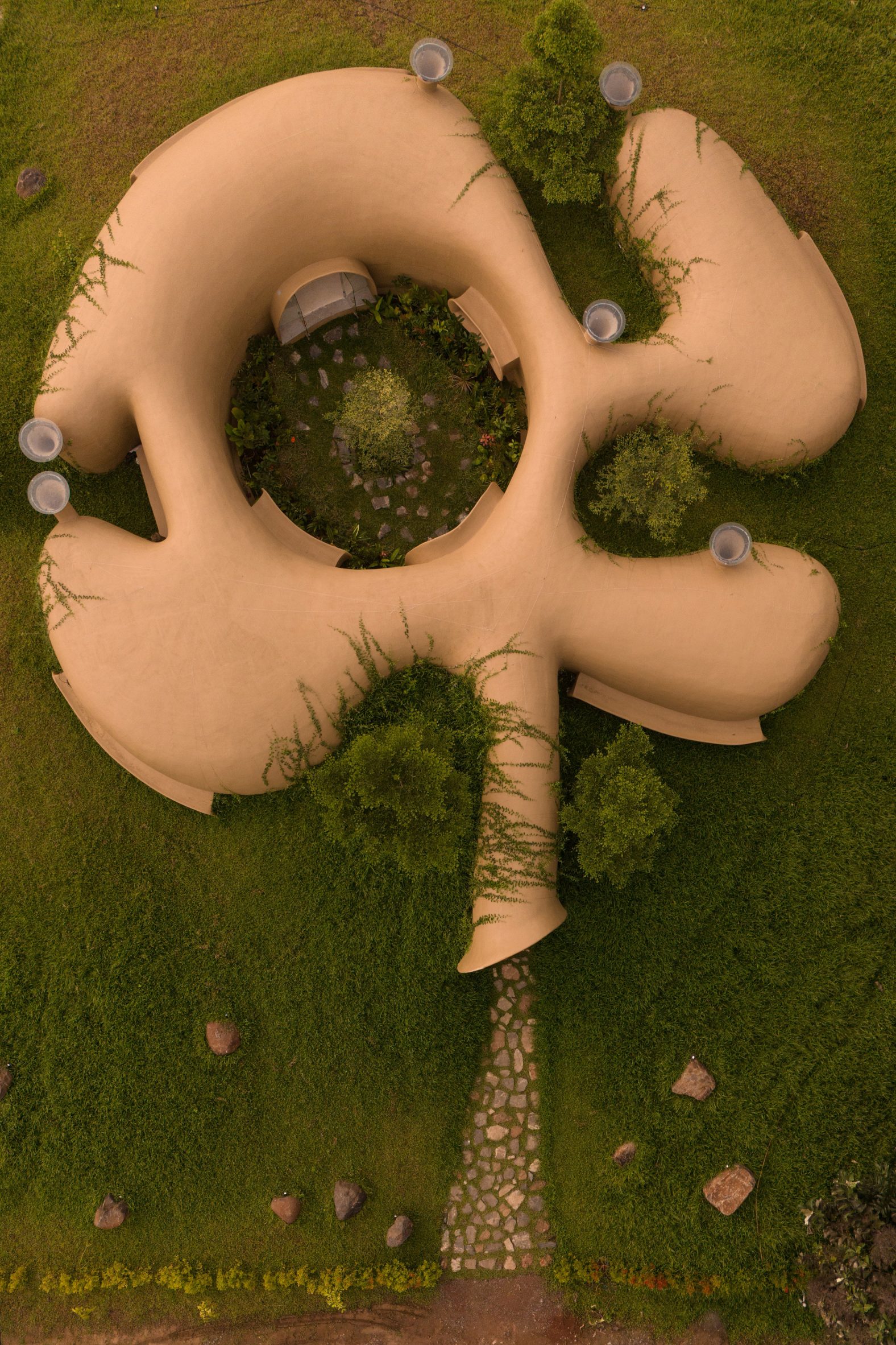 Earthscape Studio creates cave-like form for The Wild House in India