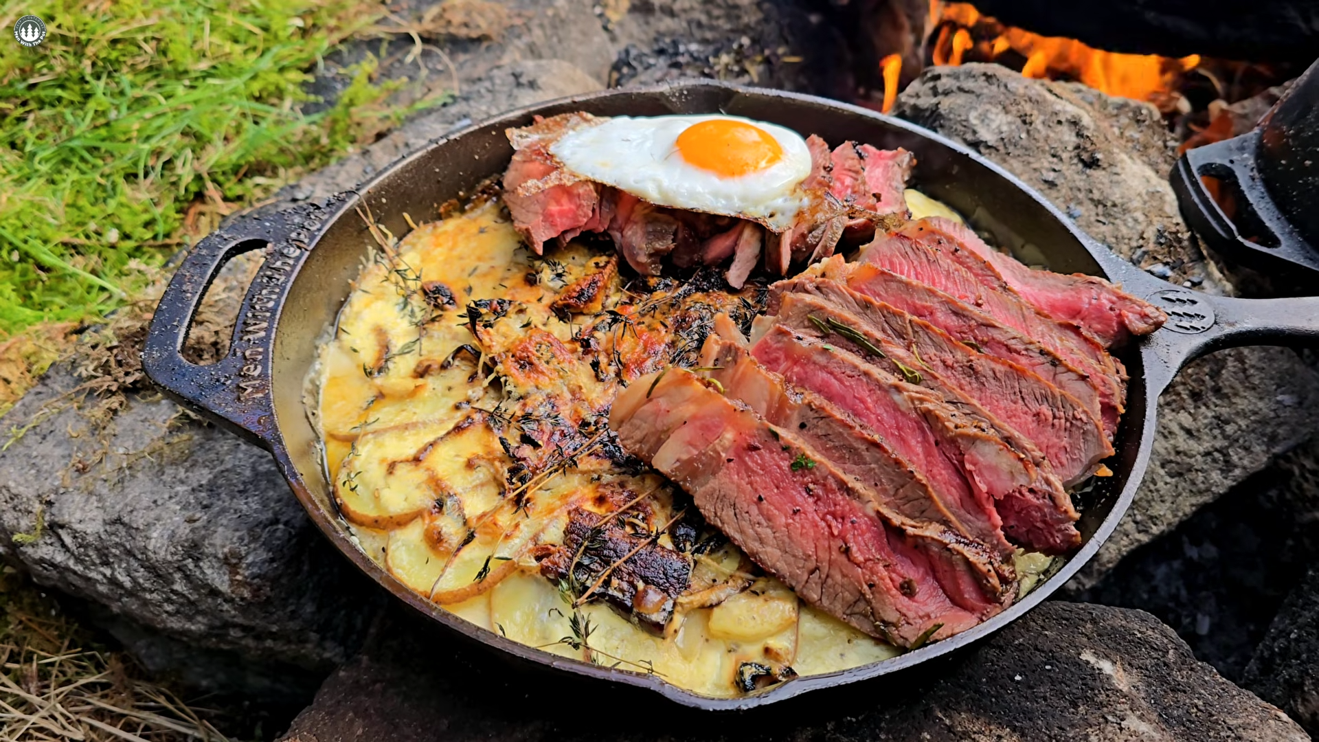 Watch how primitive cooking turns steak eggs and potatoes into a full feast
