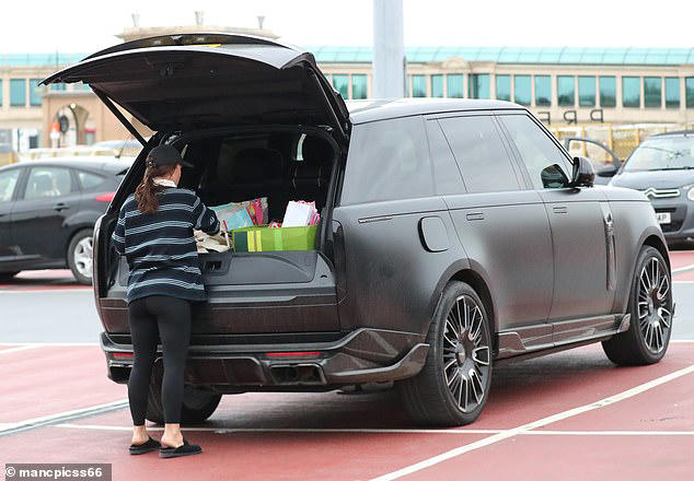 Coleen Rooney enjoys a shopping trip as she is seen without her wedding ...