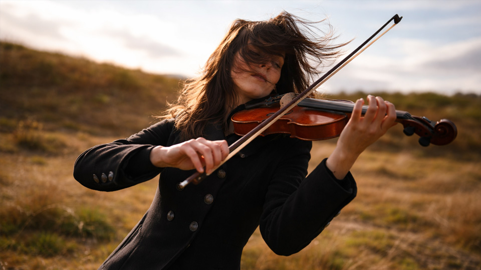 Violin performance shows movement and action