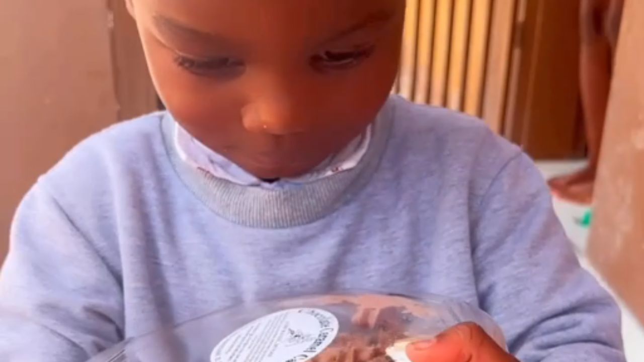 Little boy fails to hold cake tightly and drops it on the floor